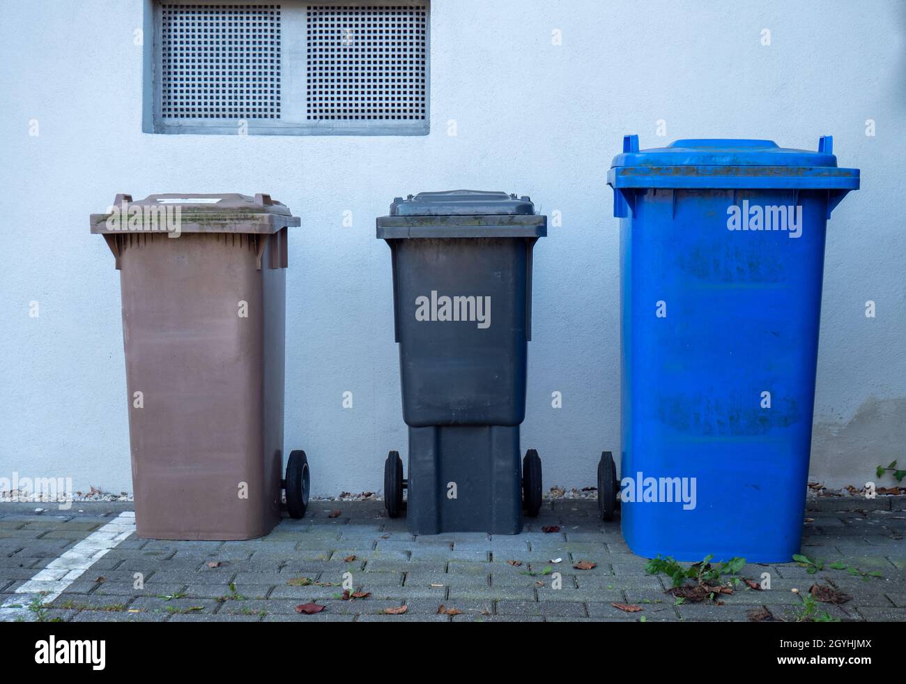 Garbage cans in different colors Stock Photo - Alamy