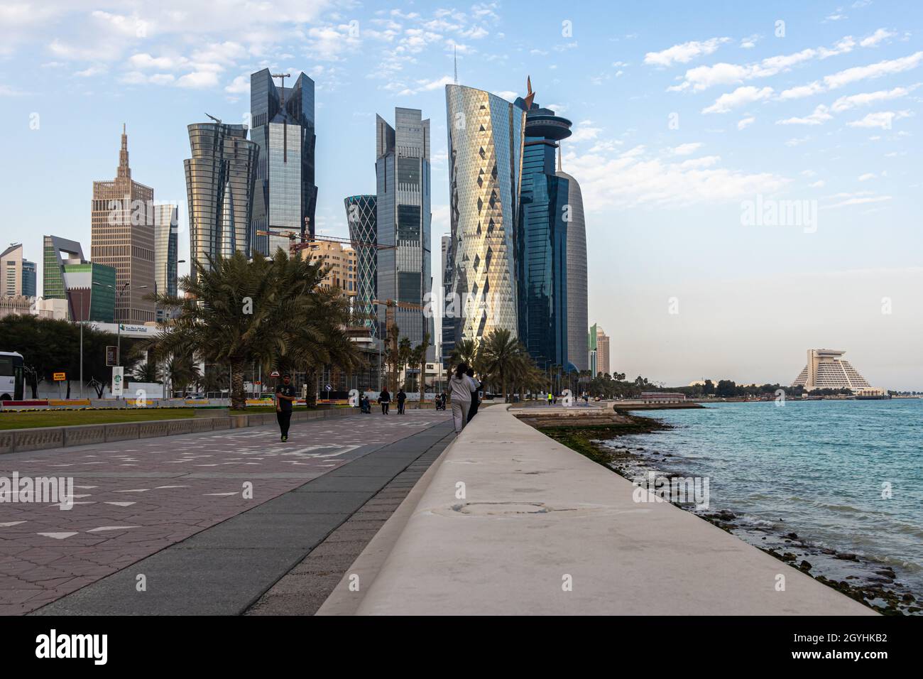 Doha corniche daylight view in west Bay area with skylines and clouds ...