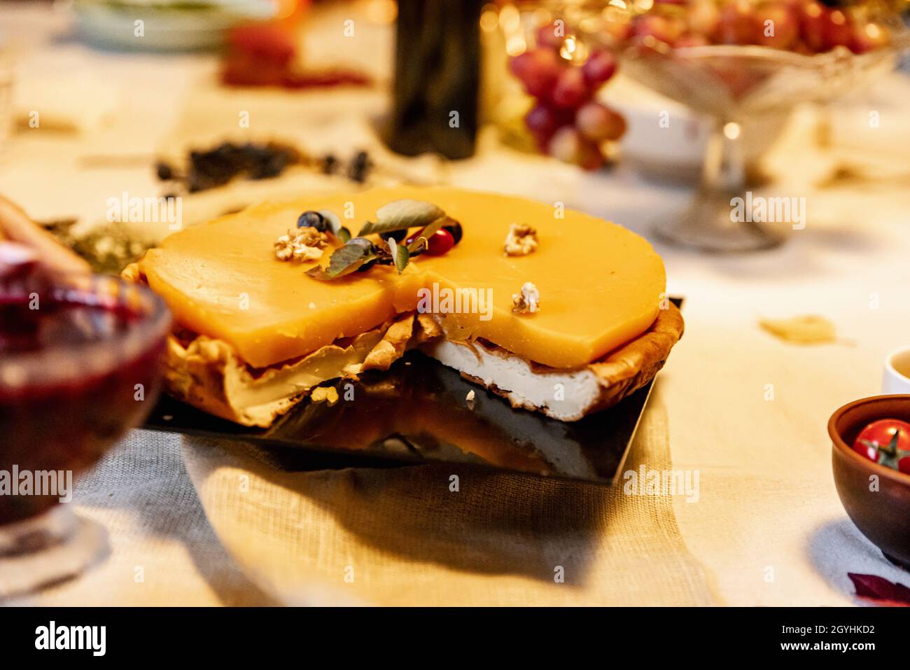 Close-up traditional pumpkin pie. Festive decorated table for ...
