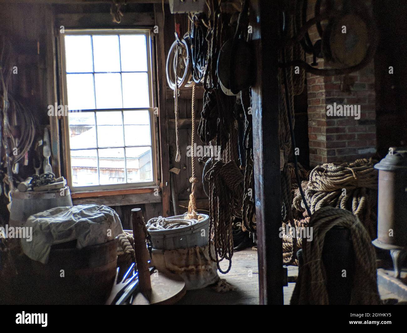 Room with old stuff like chains, ropes and buckets Stock Photo - Alamy