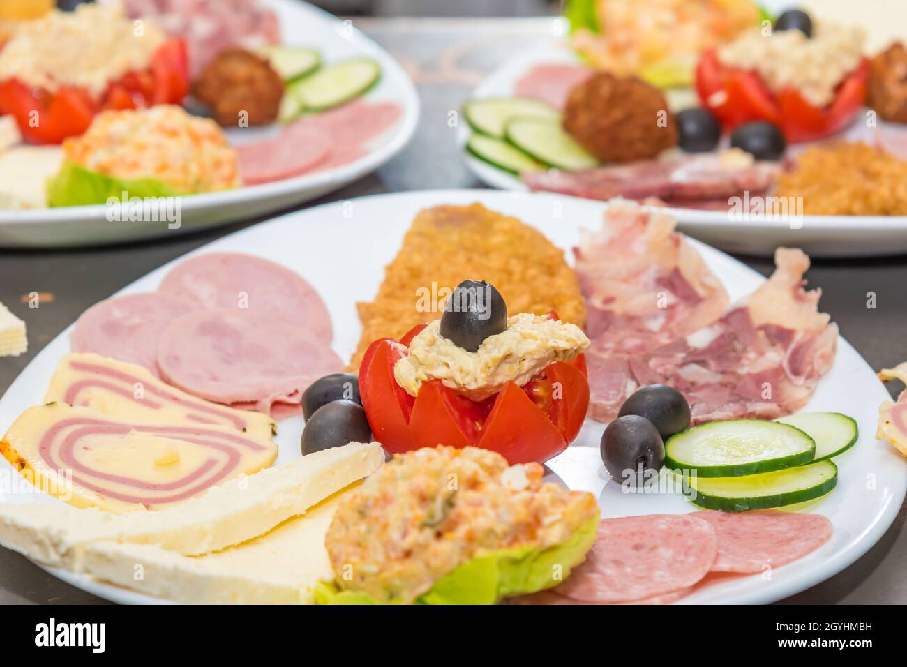 typical plate of Romanian appetizers that have stuffed tomato, cucumber ...