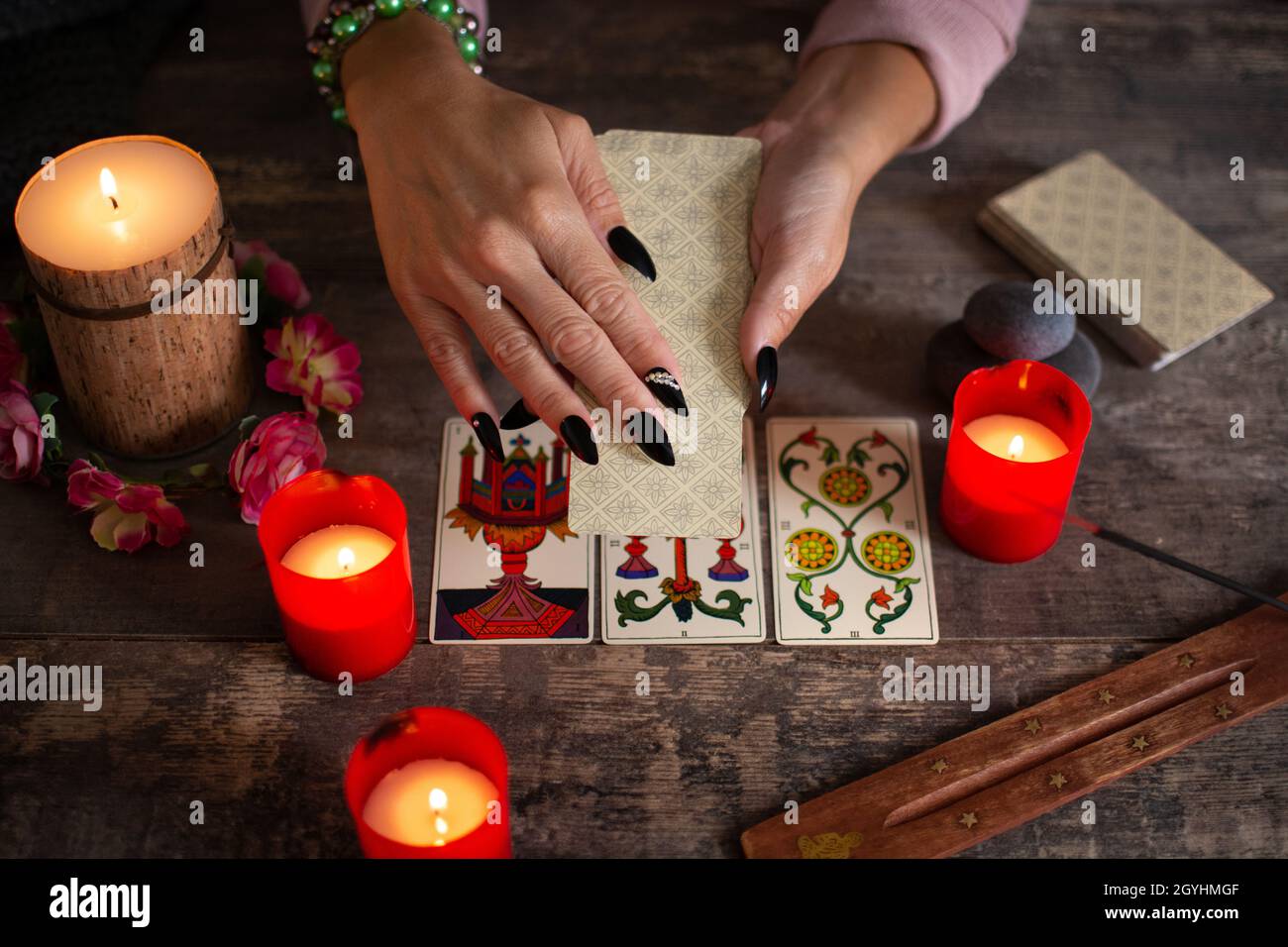 Fortune teller reading a future by tarot cards on rustic table Stock ...