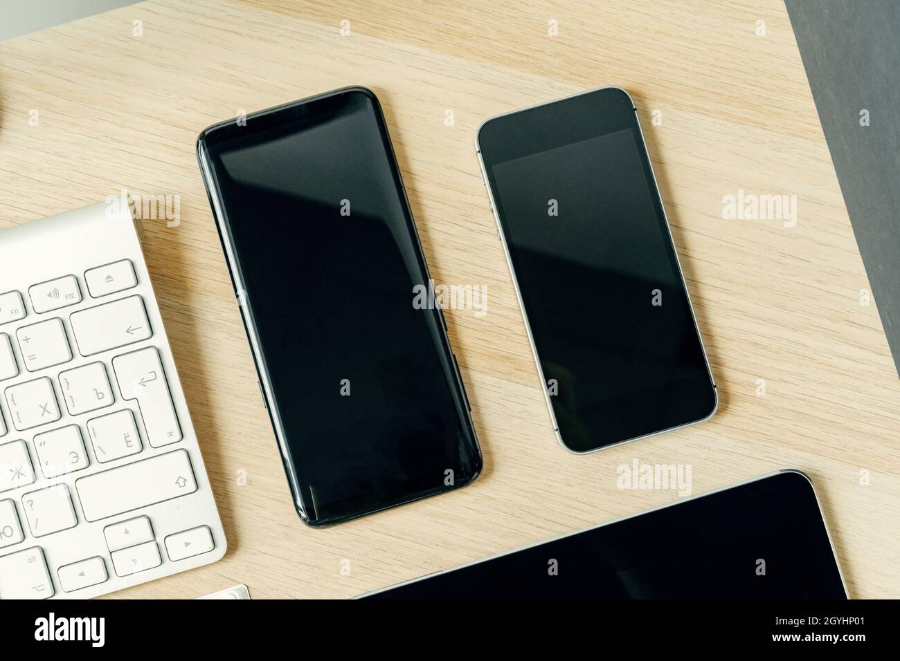 Close up shot of digital devices on office table Stock Photo - Alamy