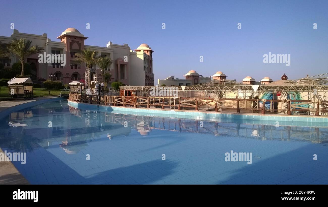 Swimming pool in luxury tropical hotel resort Stock Photo - Alamy