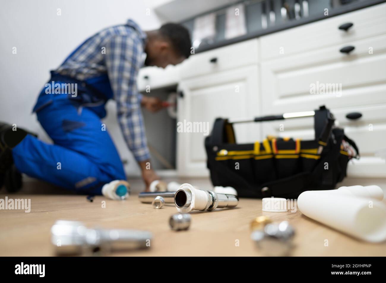 Plumber Fixing Kitchen Pipes. Water Sink Service Stock Photo - Alamy