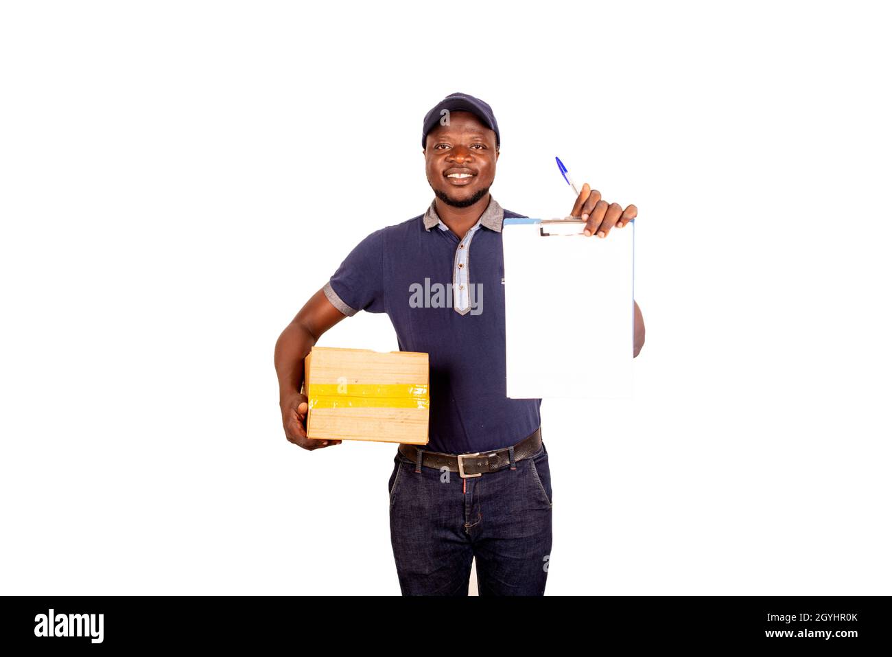 happy handsome young delivery man in blue uniform showing a paper press ...