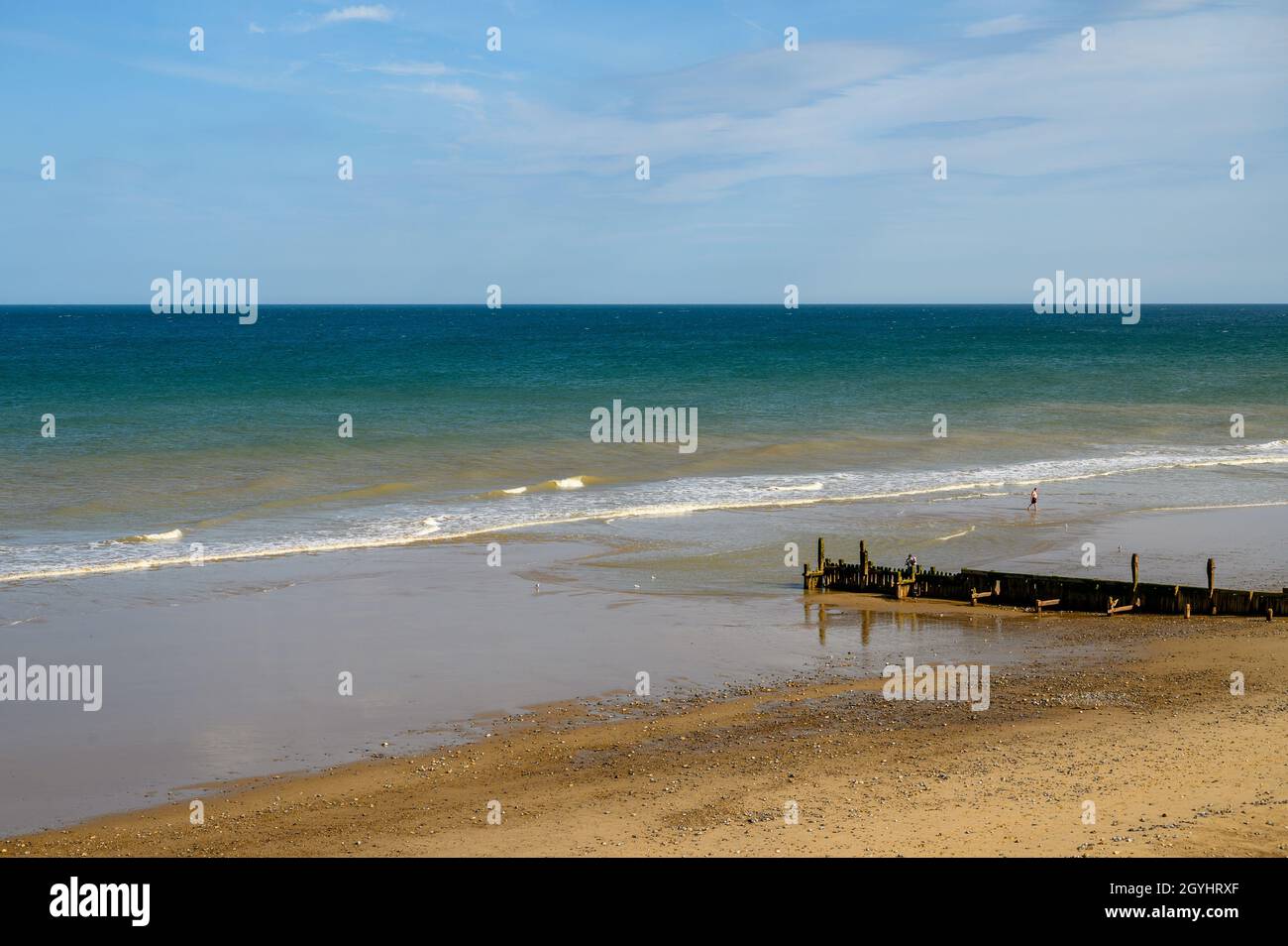 View down to Mundesley beach and the sea with just a few people ...