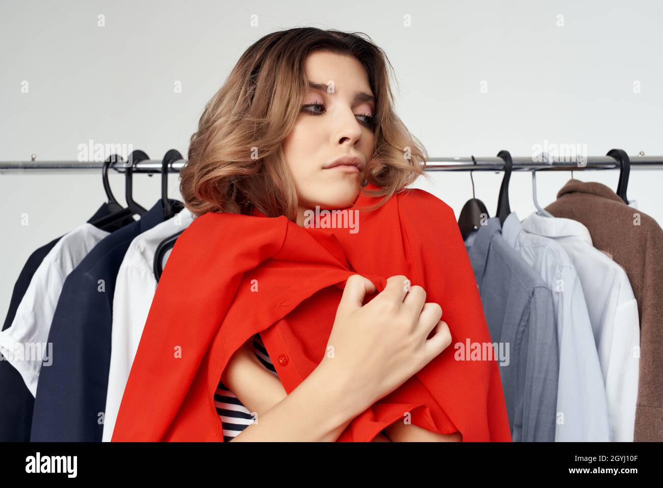 pretty woman near clothes shopaholic isolated background Stock Photo ...