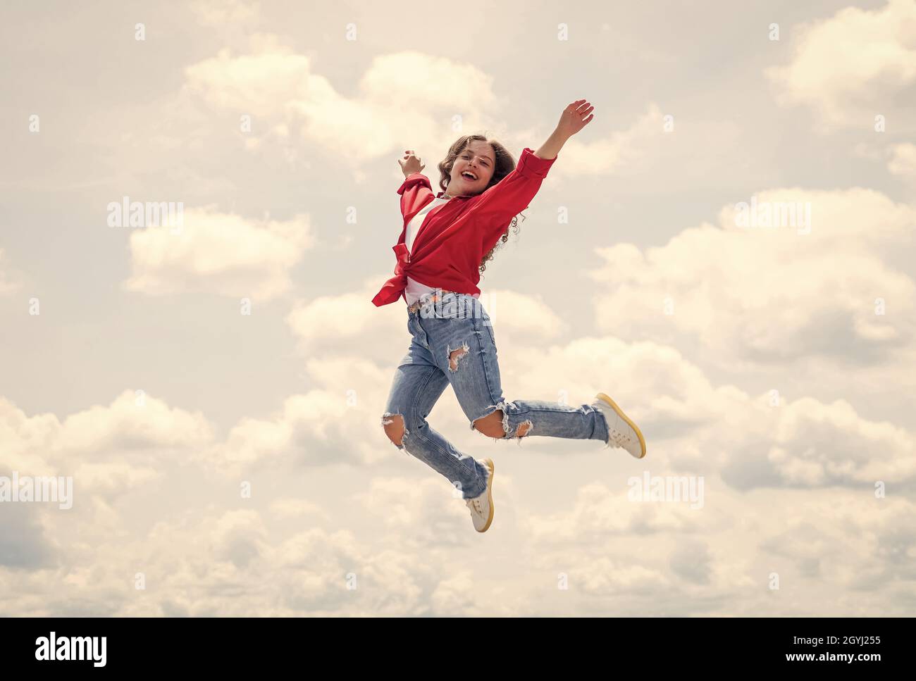 happy energetic kid feeling free and jumping high, freedom Stock Photo ...