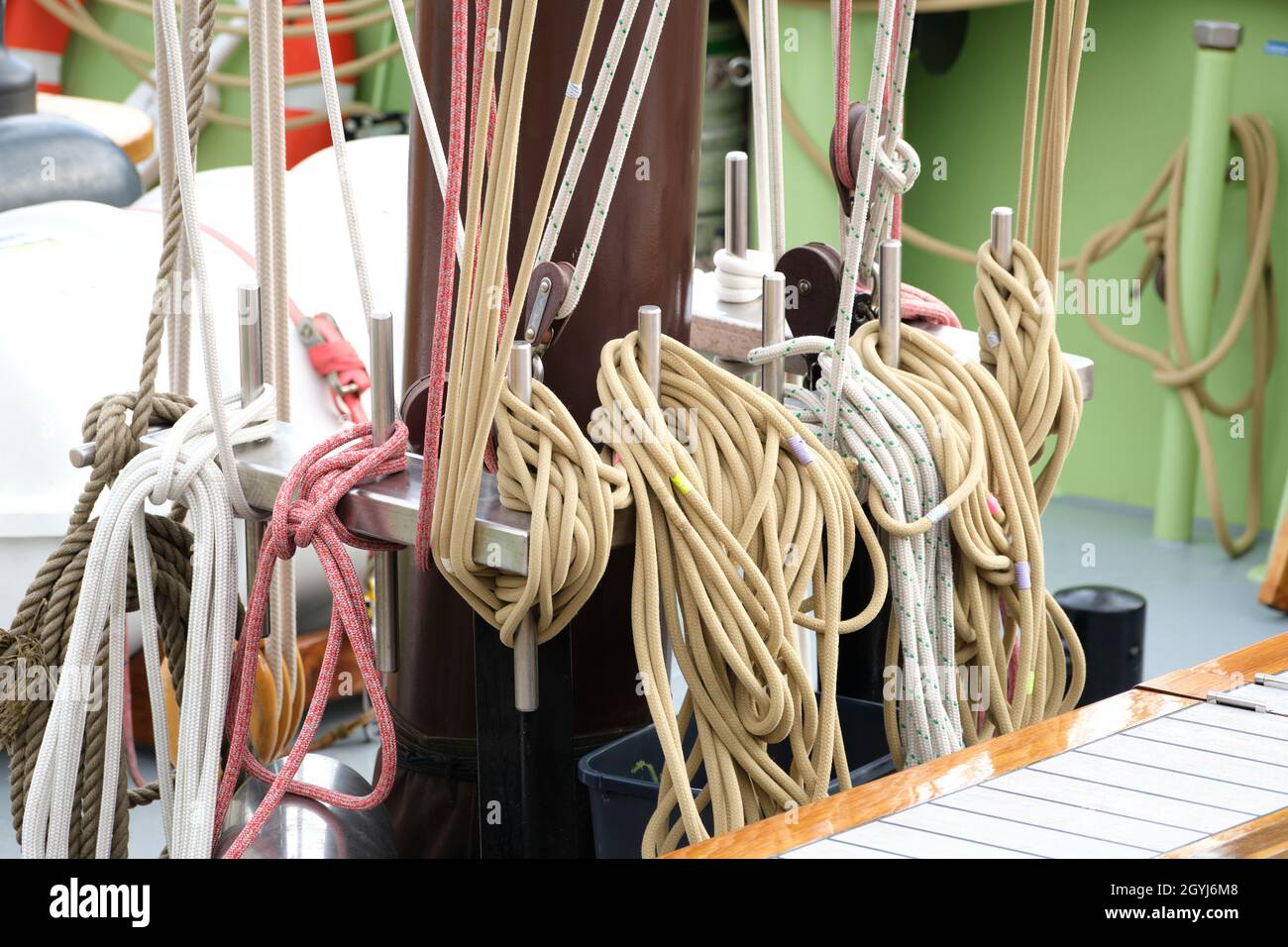 Many ropes tangled up at a wooden mast of a big sailing ship Stock ...