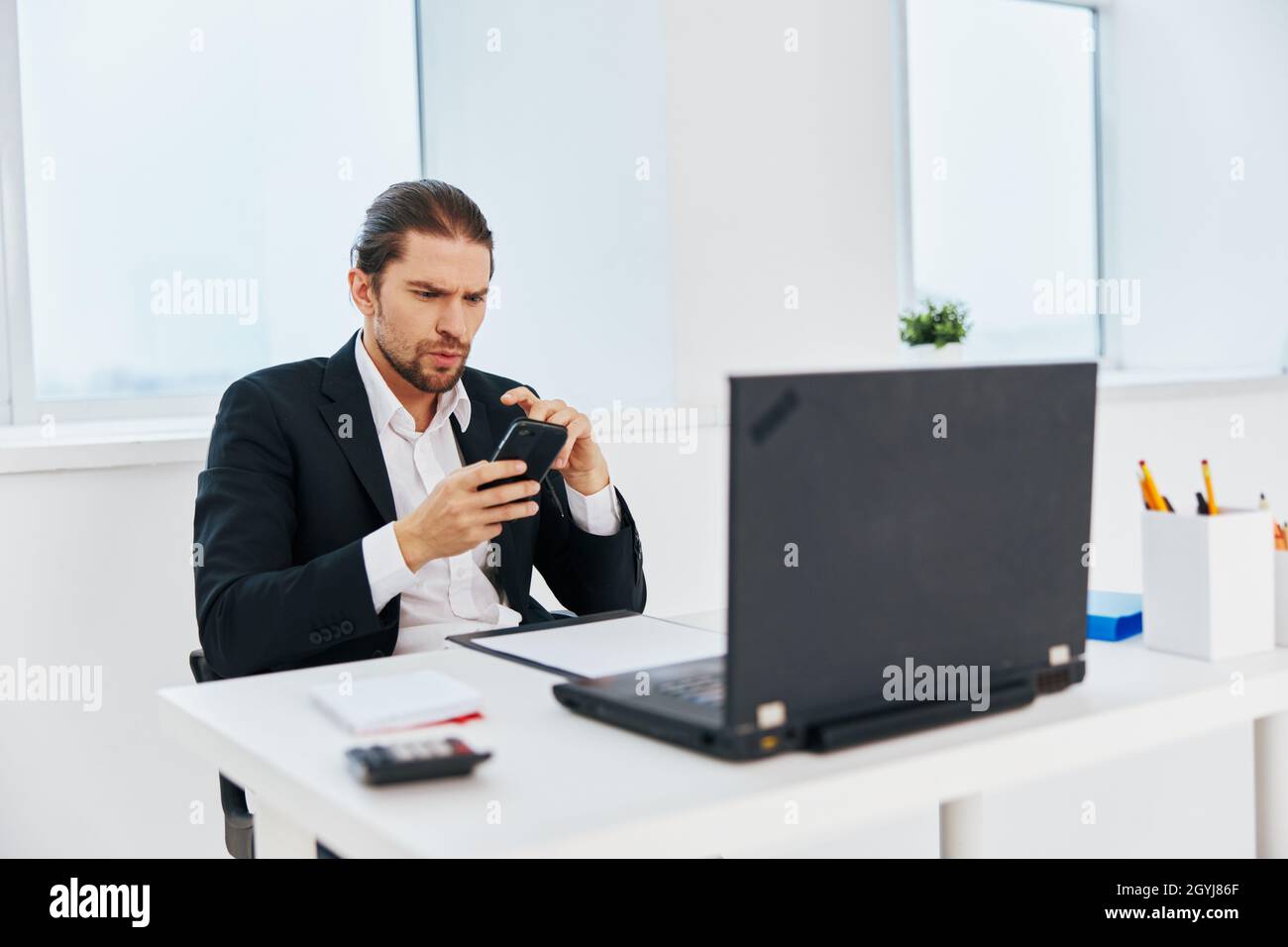 manager office work documents with a phone in hand boss Stock Photo - Alamy