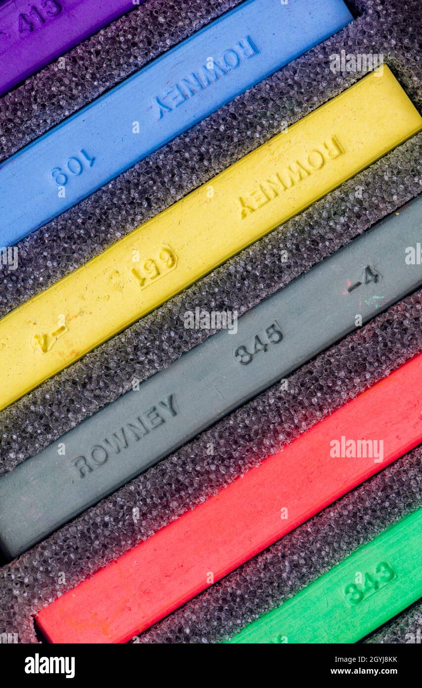 multi-coloured pastel paints in a box. brightly coloured painters ...