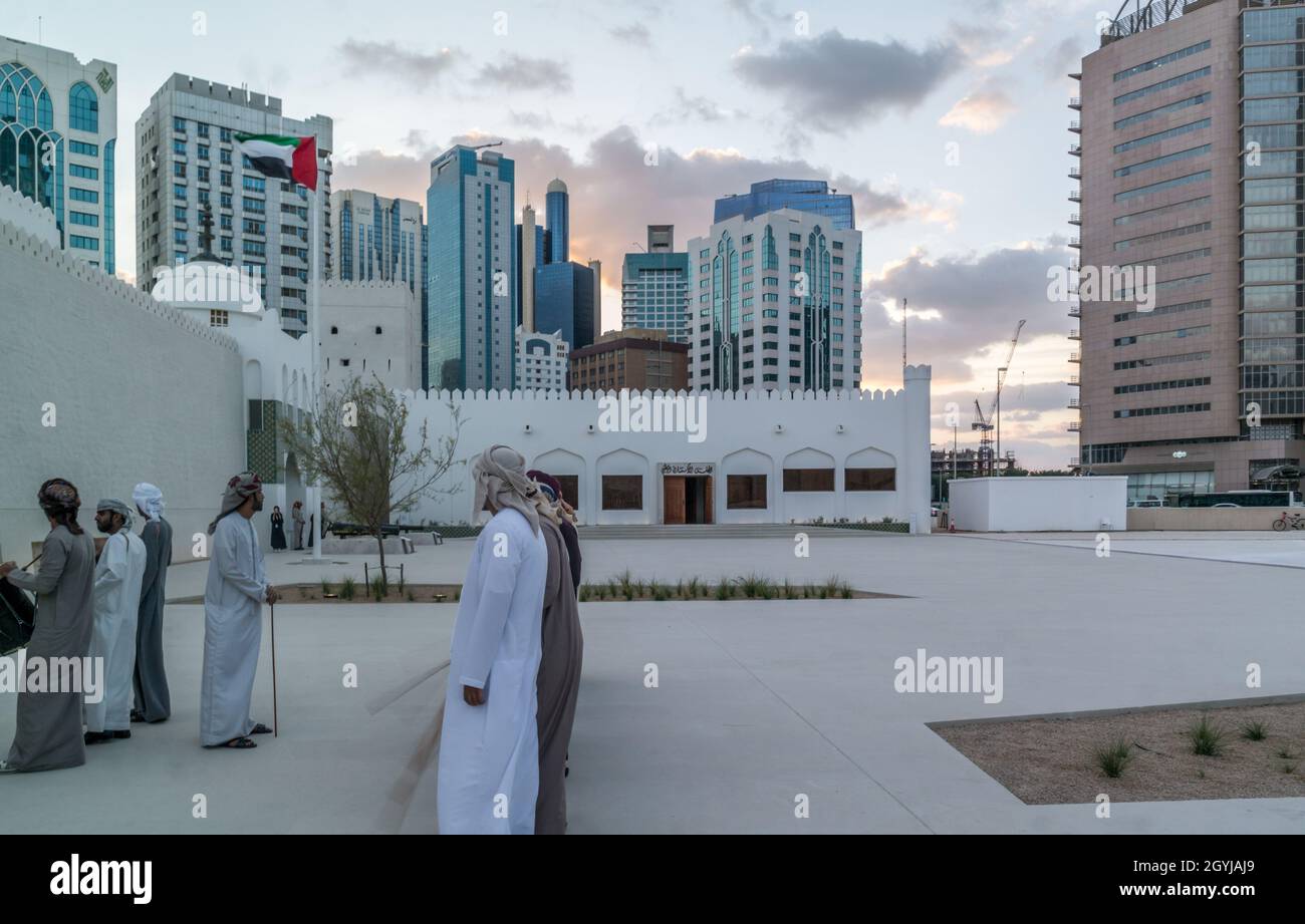 Emirati Men performing the Yowla, a traditional dance in the heritage ...