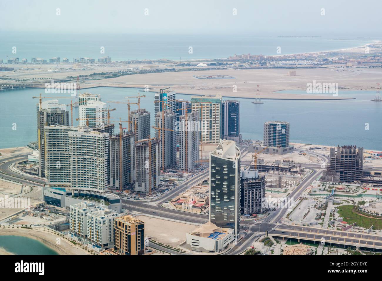 Aerial drone shot of Al Reem island buildings - Gate towers, Sun and ...