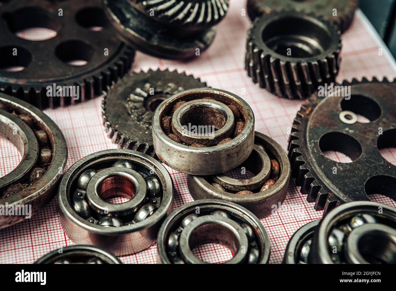 Car parts on graph paper close up. Engineering concept Stock Photo - Alamy