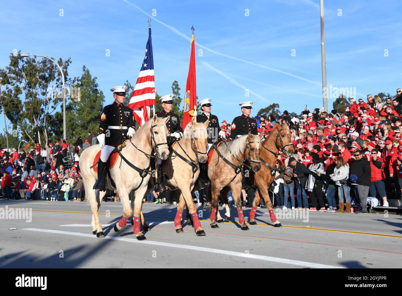 The Marine Corps Mounted Color Guard pass through the streets of ...