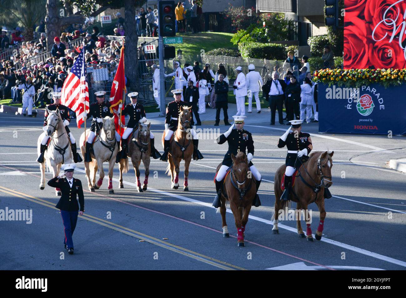 The Marine Corps Mounted Color Guard pass through the streets of ...