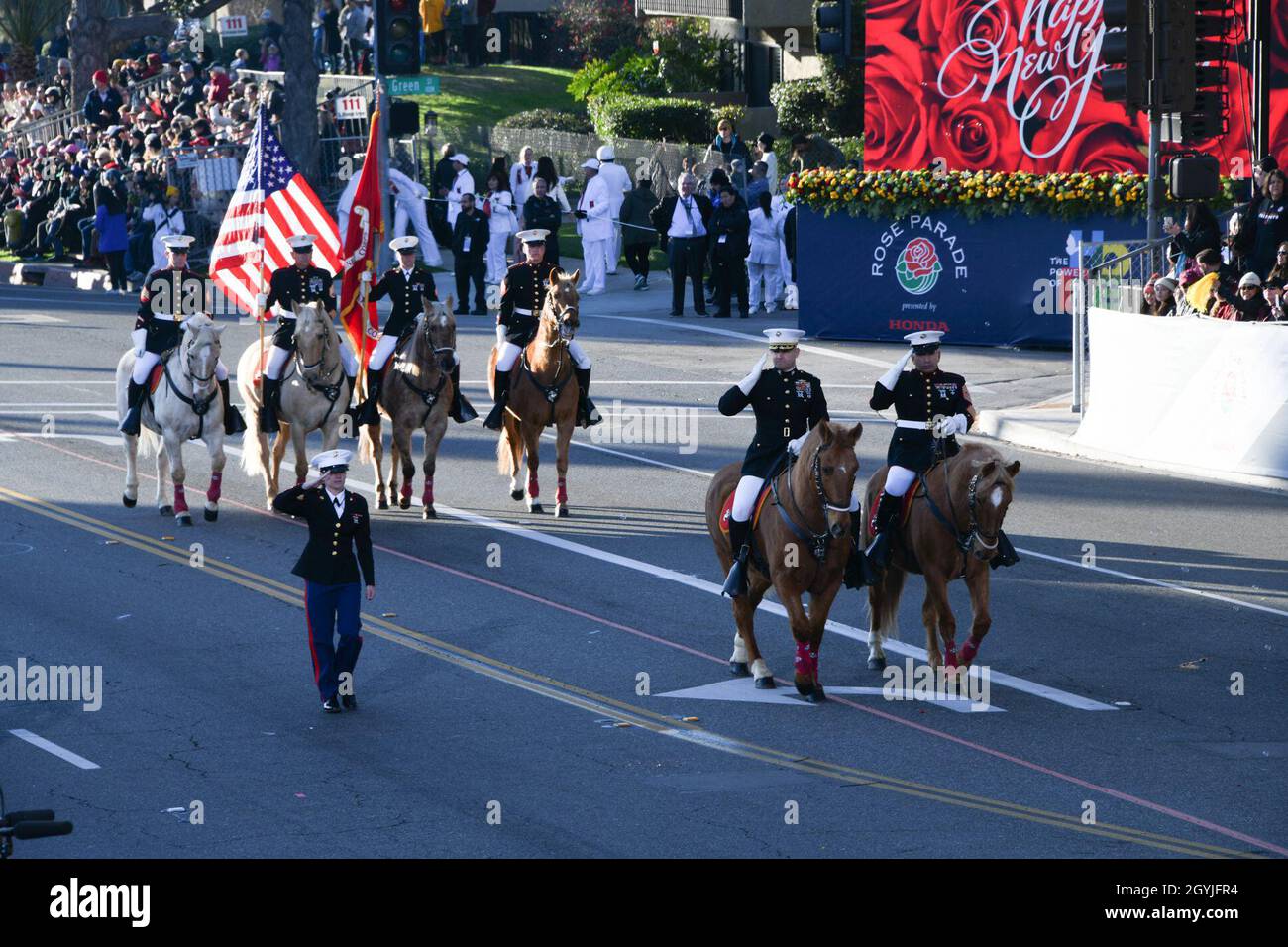 The Marine Corps Mounted Color Guard pass through the streets of ...