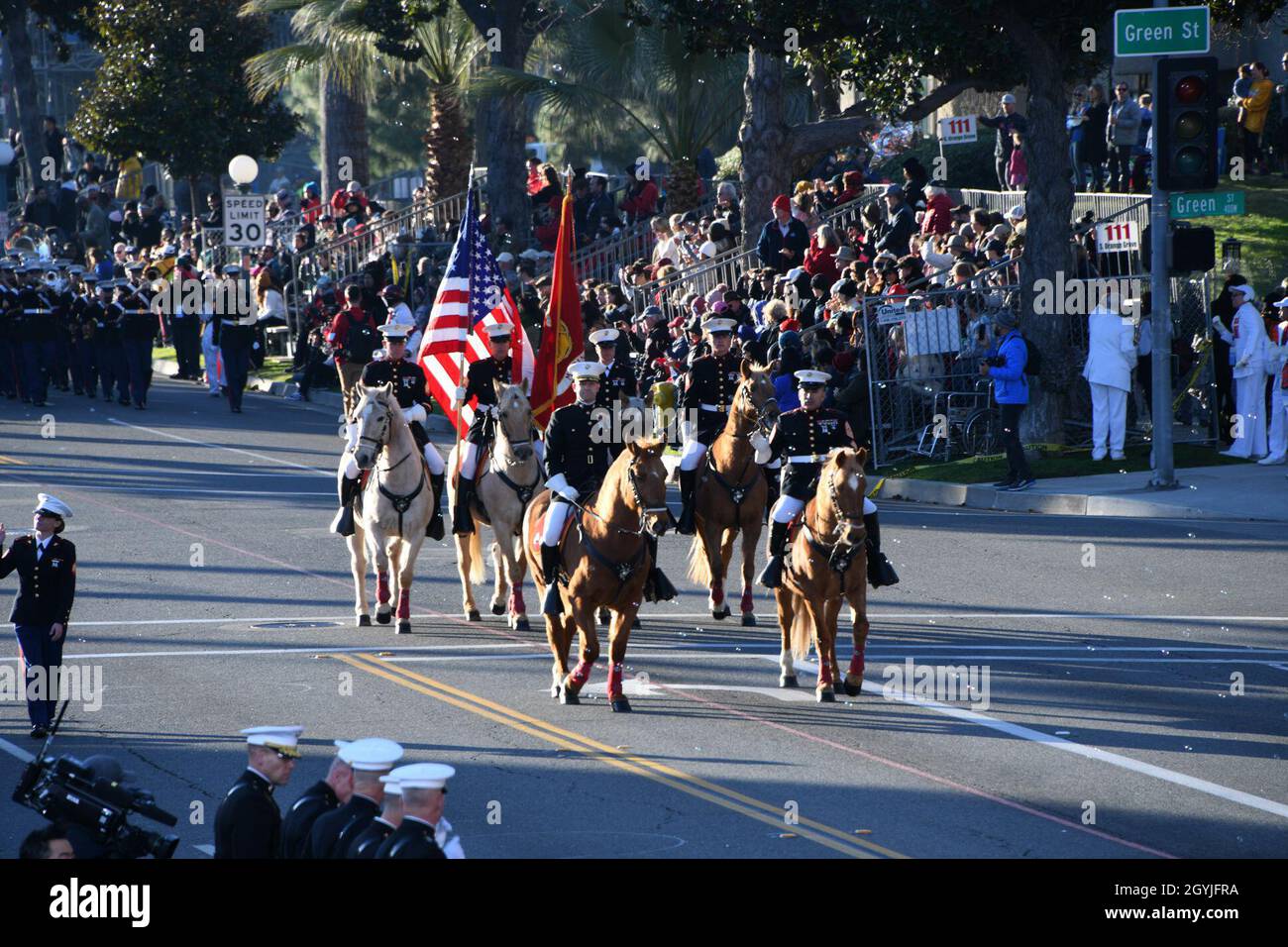 The Marine Corps Mounted Color Guard pass through the streets of ...