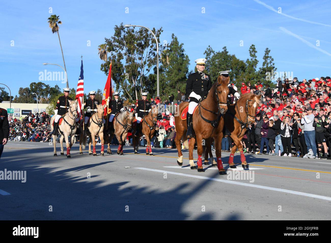 The Marine Corps Mounted Color Guard pass through the streets of ...