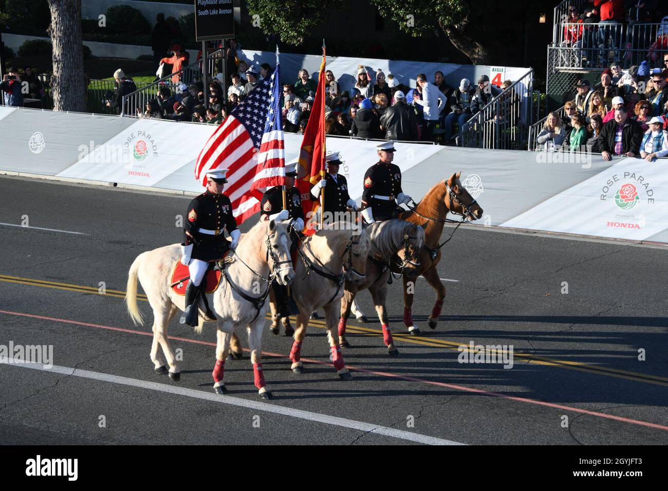 The Marine Corps Mounted Color Guard pass through the streets of ...