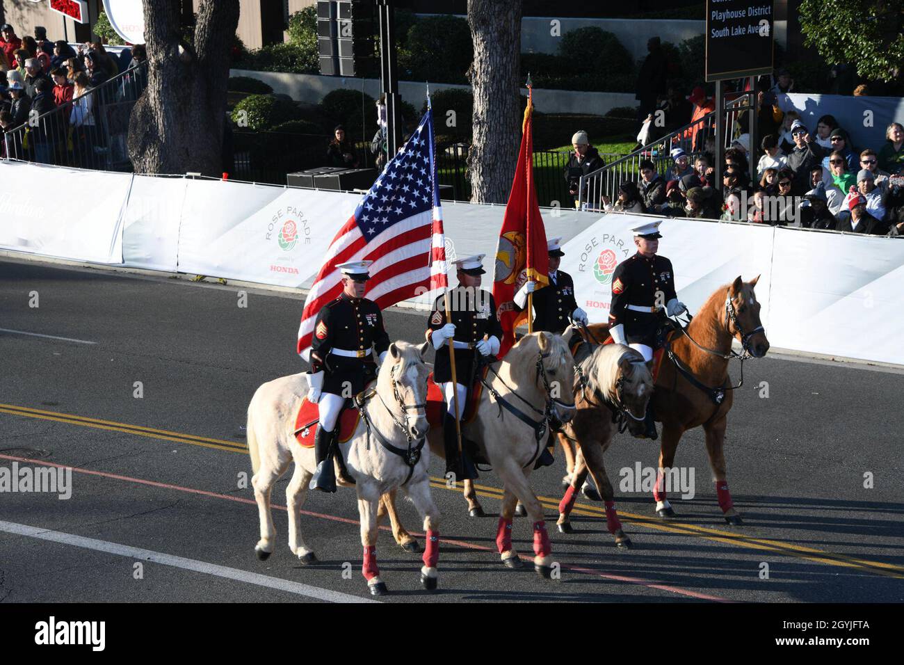 The Marine Corps Mounted Color Guard pass through the streets of ...