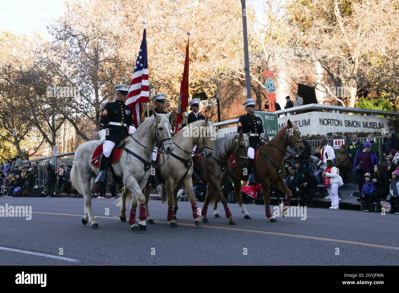The Marine Corps Mounted Color Guard pass through the streets of ...