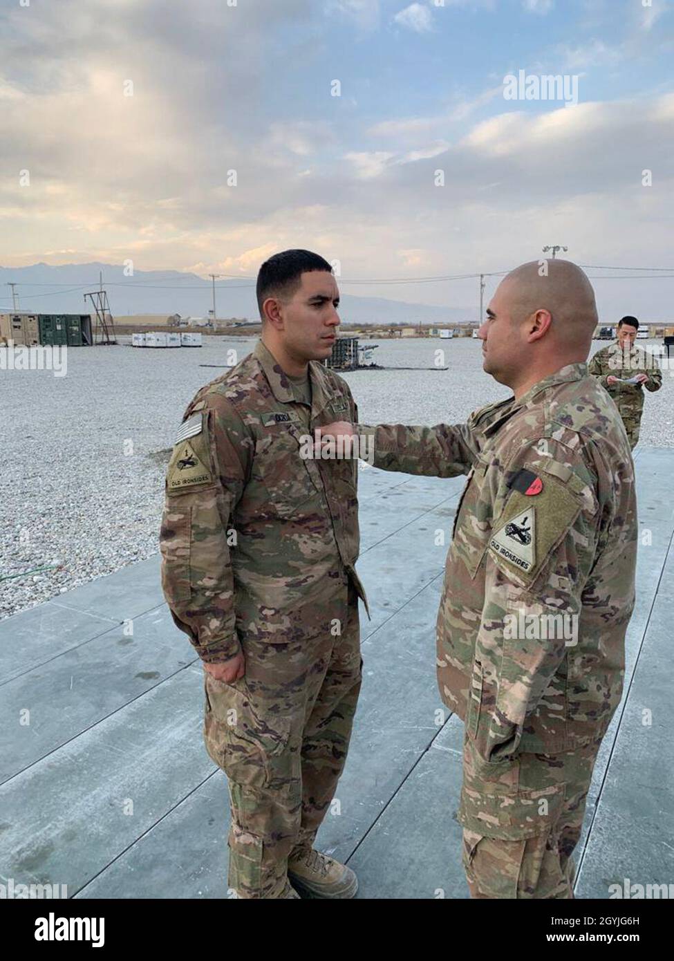 Sgt. Andres Rios pins newly promoted Sgt. Austin Ochoa to the rank of ...