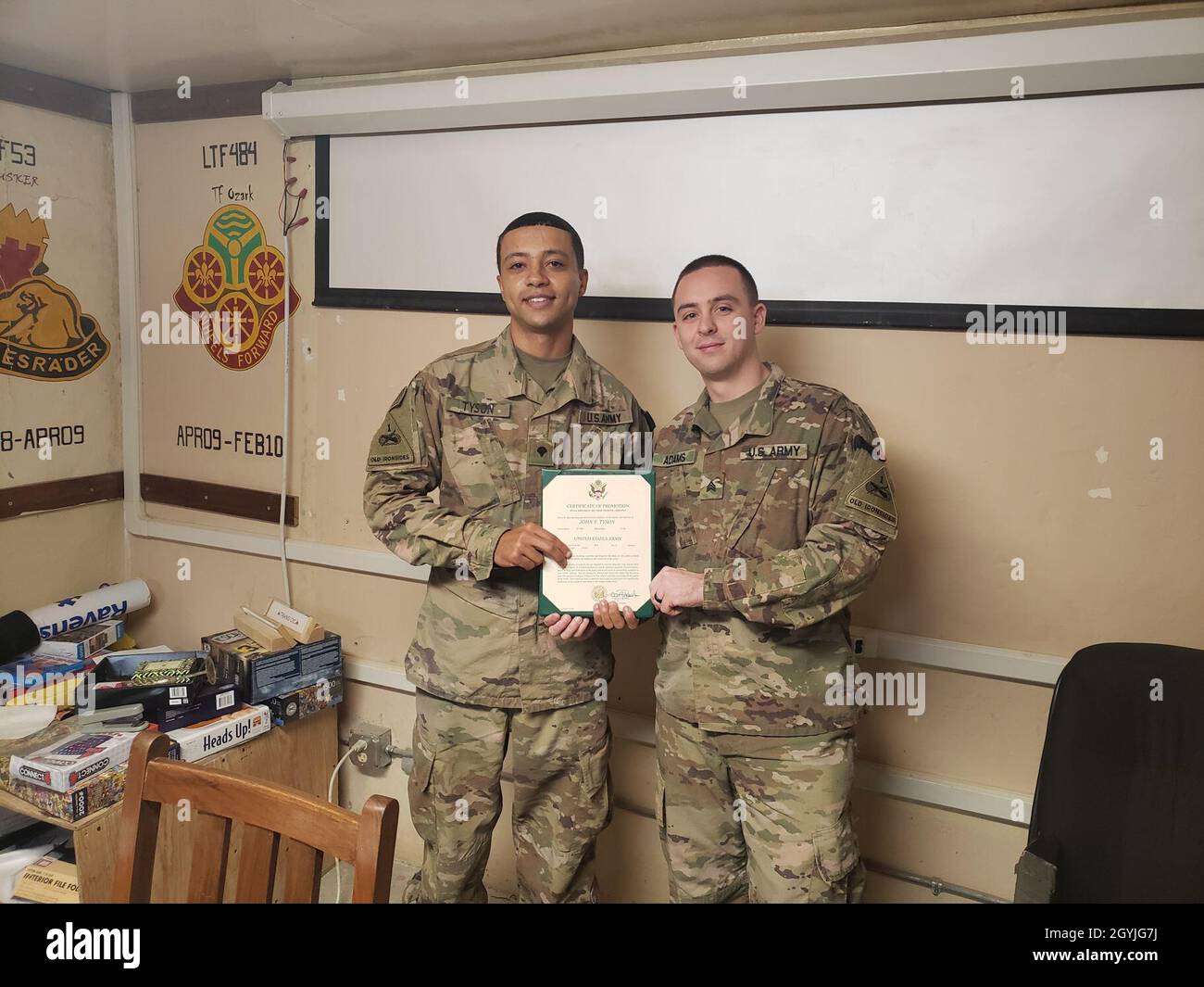 Newly promoted Spc. John Tyson poses with his supervisor Sgt. Jerrod ...