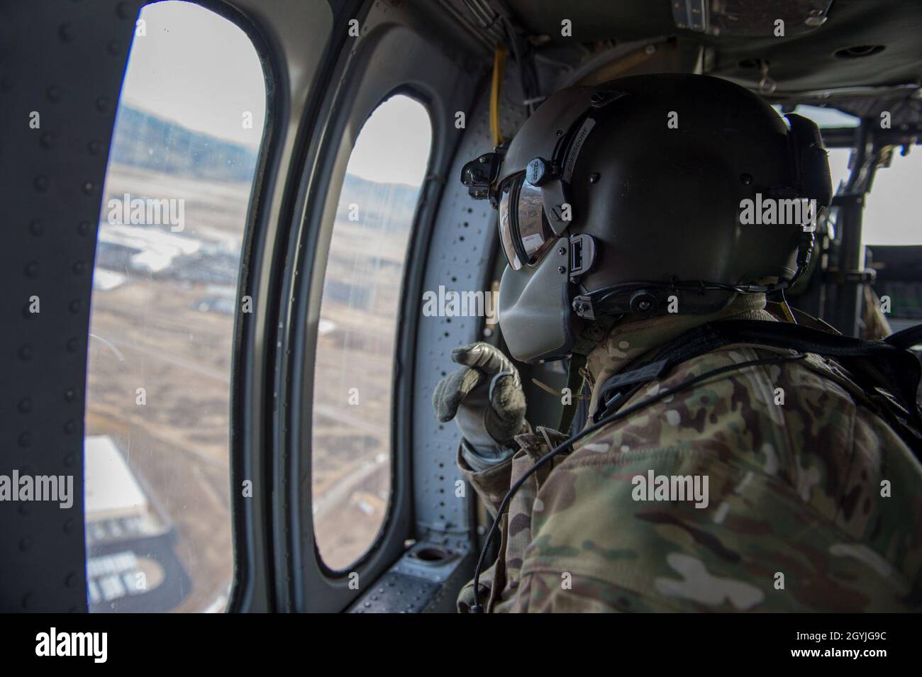 A helicopter crew chief with the 1-183rd Aviation Battalion, Idaho Army ...