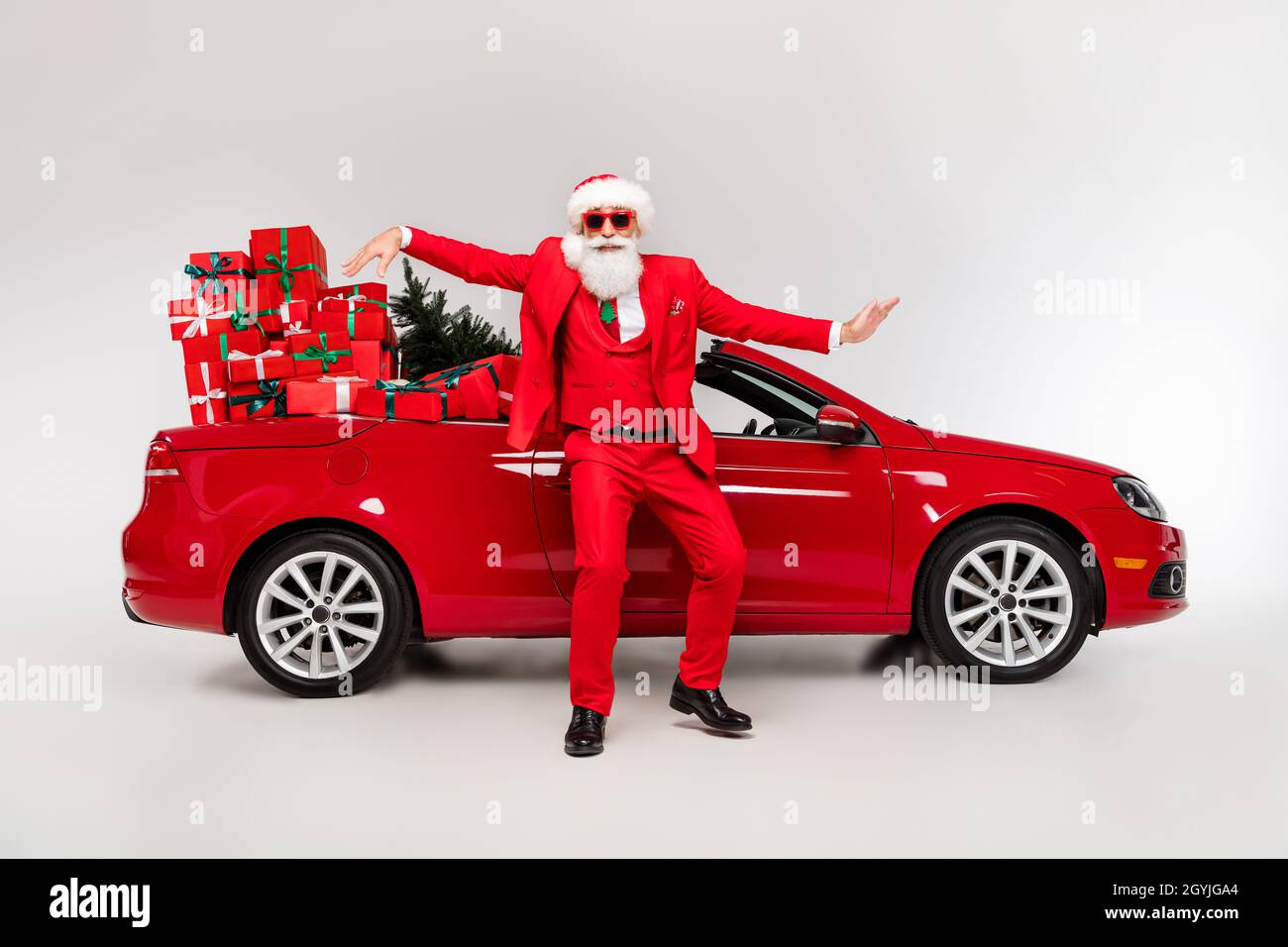 Full length body size view of attractive funny comic Santa dancing ...