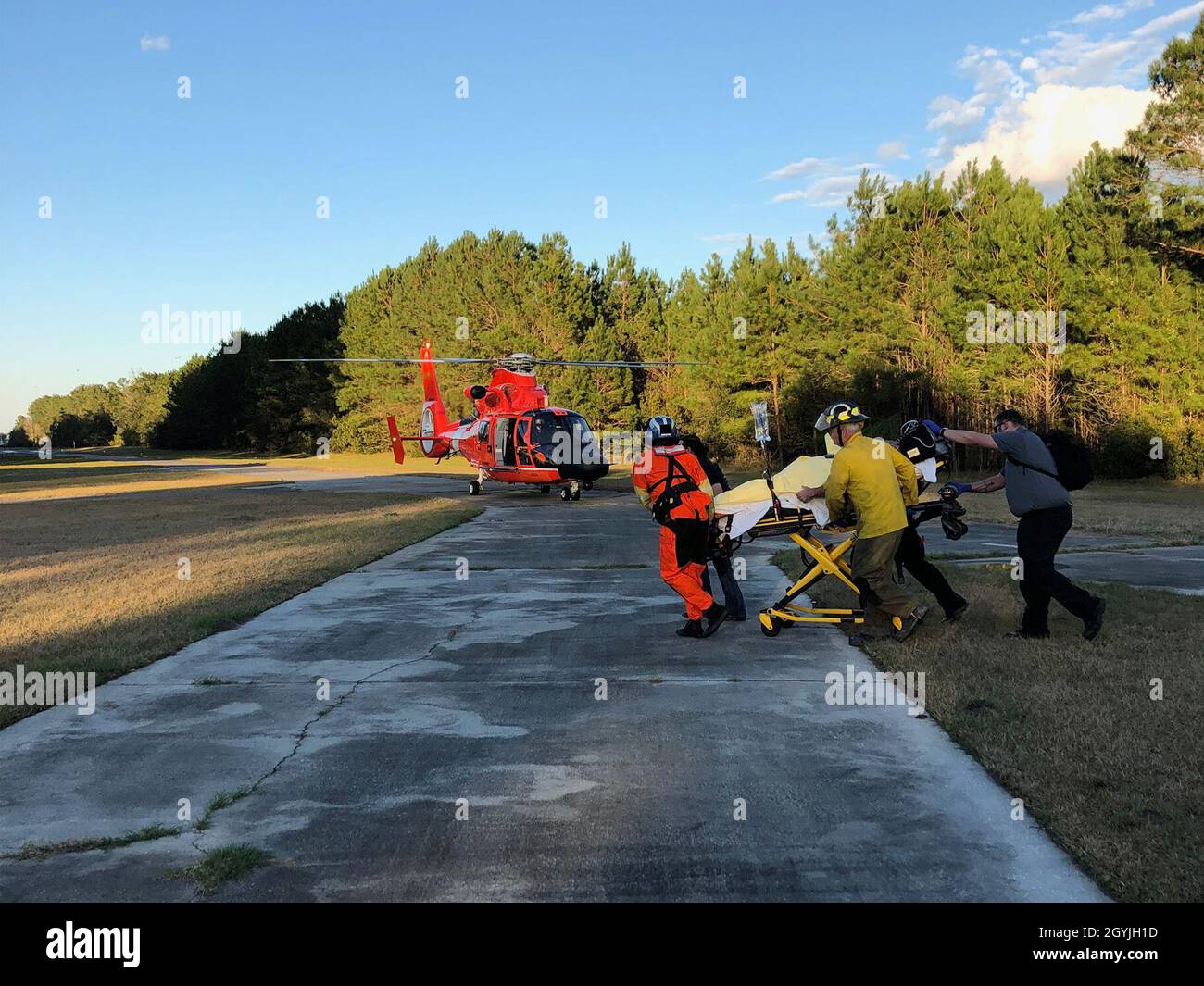 A Coast Guard Air Station Savannah MH-65 Dolphin helicopter crew ...