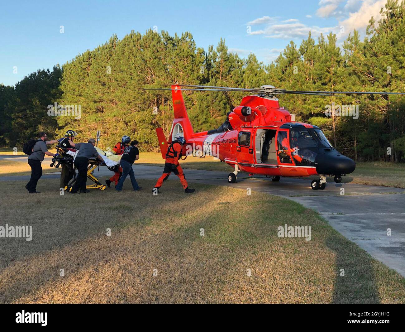 A Coast Guard Air Station Savannah MH-65 Dolphin helicopter crew ...