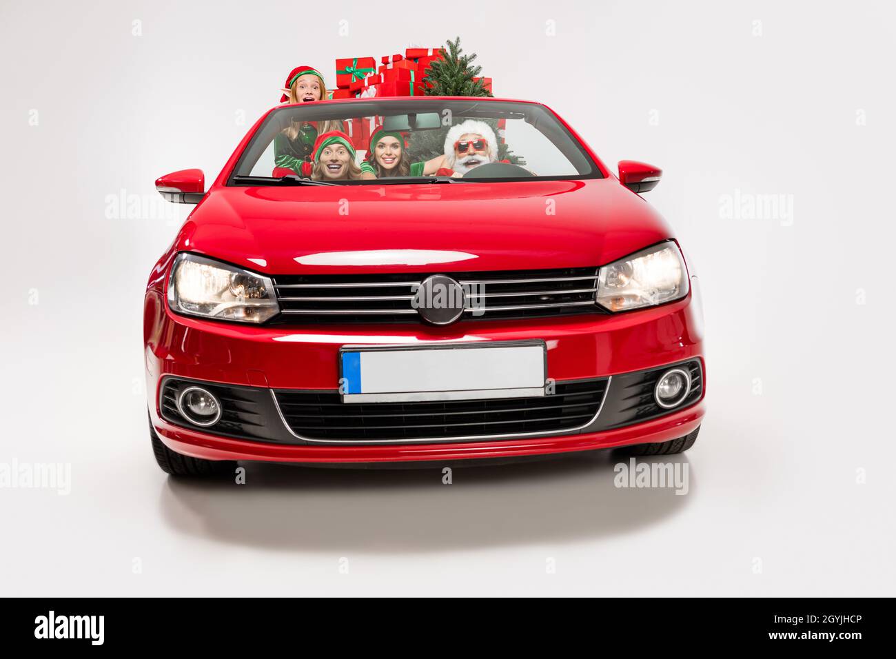 Photo of funky delivery people prepare x-mas drive auto car presents ...