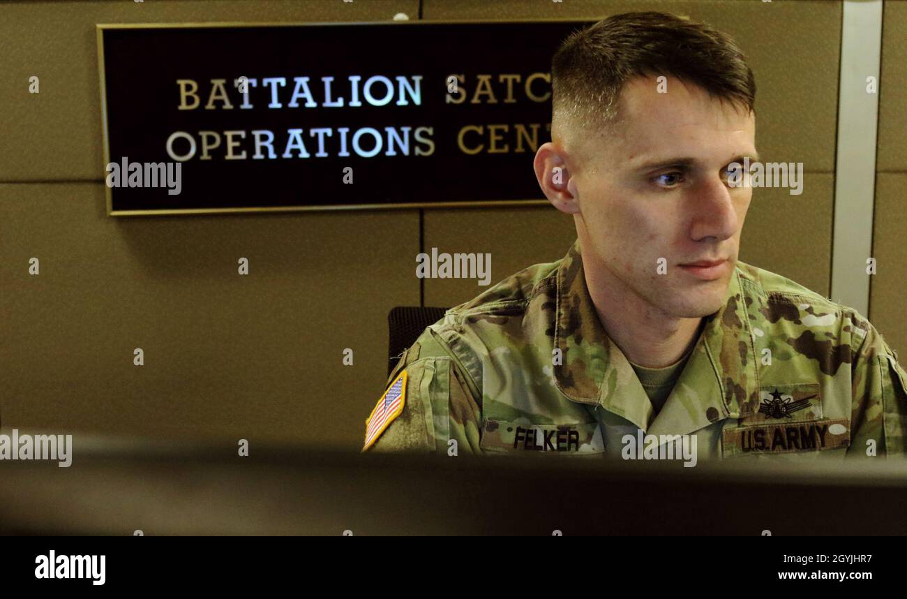 SSG Matthew Felker, HHC 53rd Signal BN oversees his troops as they work ...
