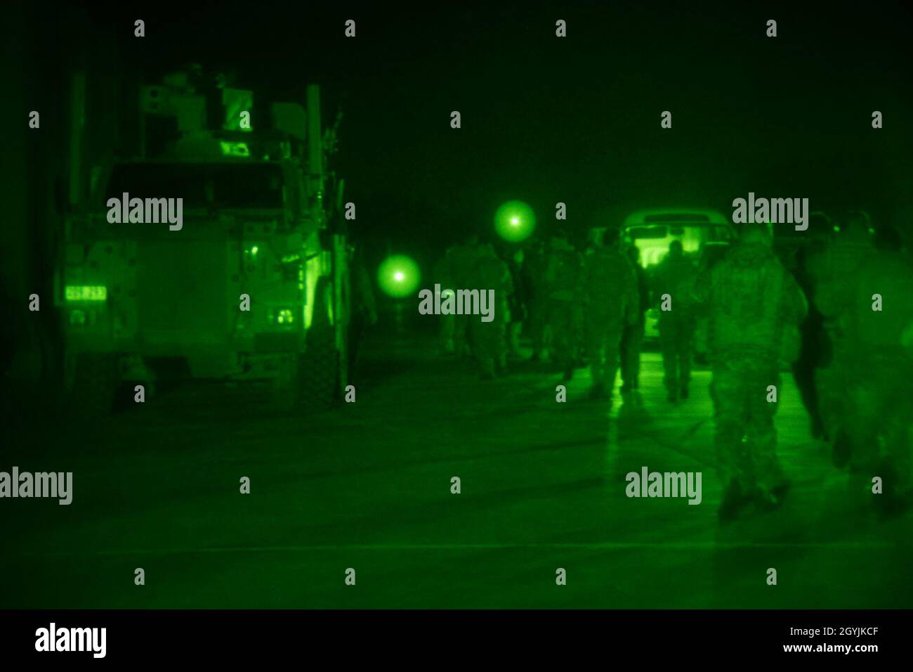 British soldiers prepare to board a bus at Camp Taji, Iraq, Jan. 7 ...
