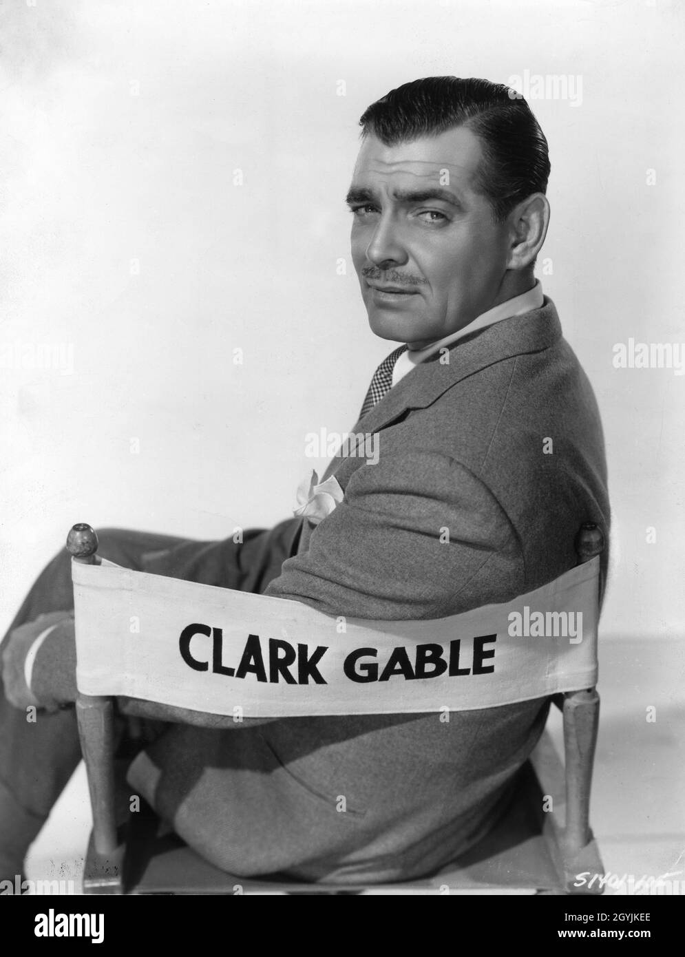 CLARK GABLE Portrait sitting in Director Chair publicity for THE ...