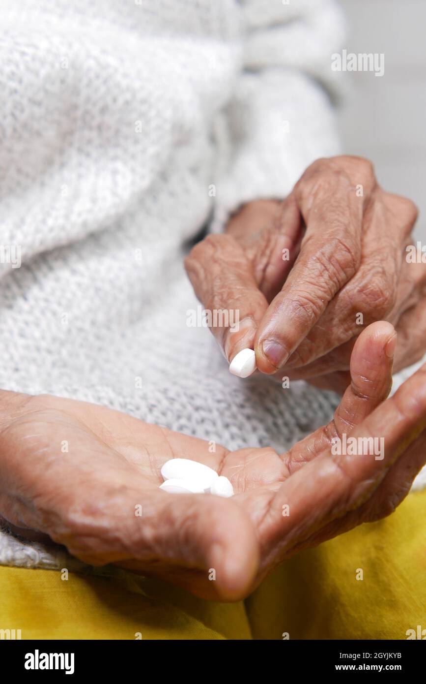 Senior women hand hold hi-res stock photography and images - Alamy