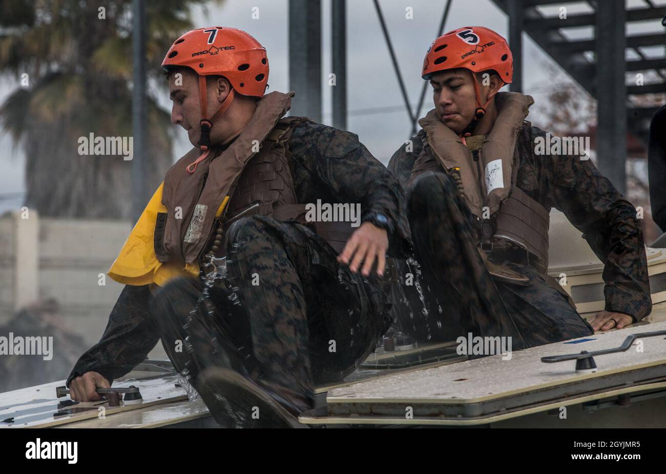 U.S. Marines with Assault Amphibian School, Training Command, exit a ...