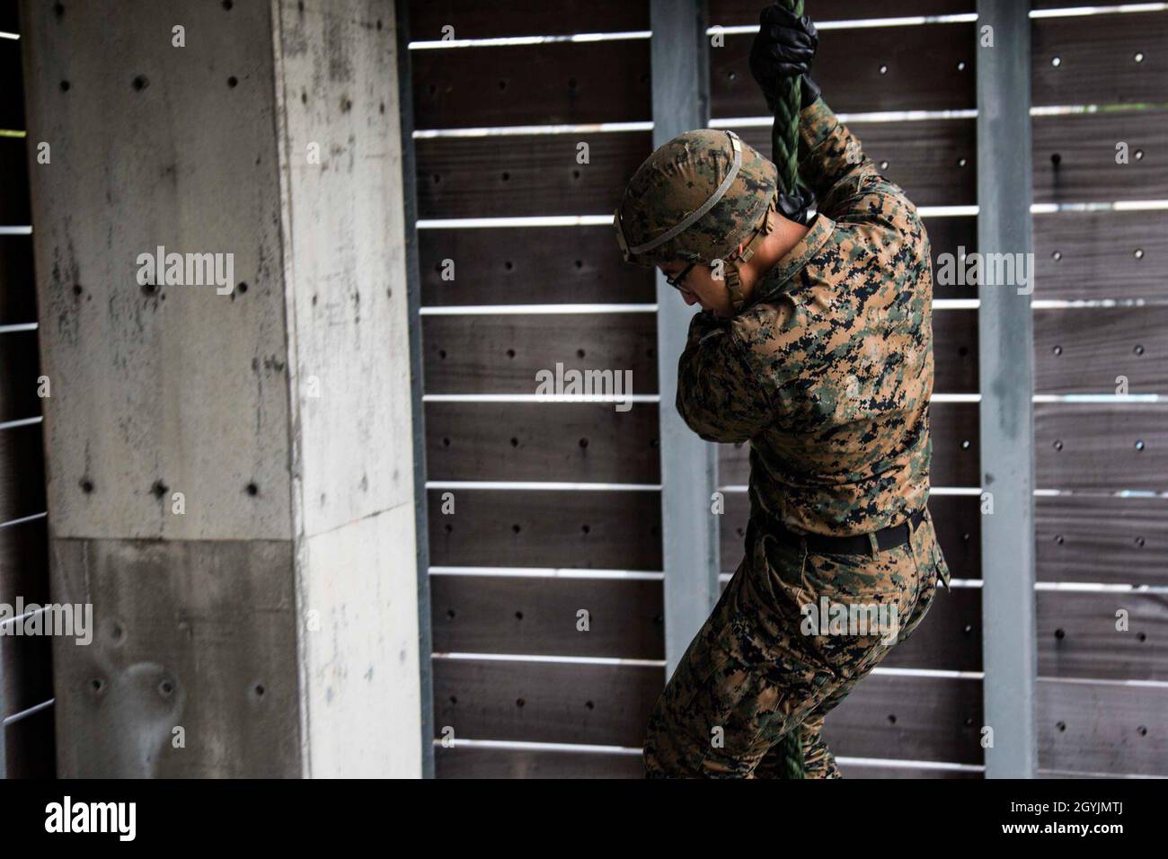 U.S. Marine Cpl. William Caras conducts fast roping during a Helicopter ...