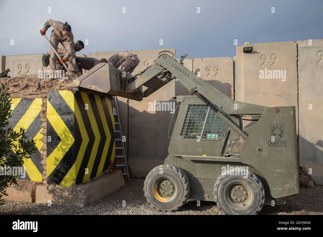 The Spanish army engineer unit packs new sand bags on top of bunkers at ...