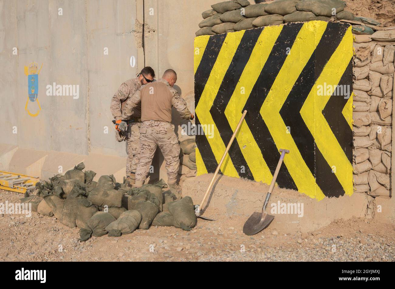 The Spanish army engineer unit replaces old sand bags while reinforcing ...