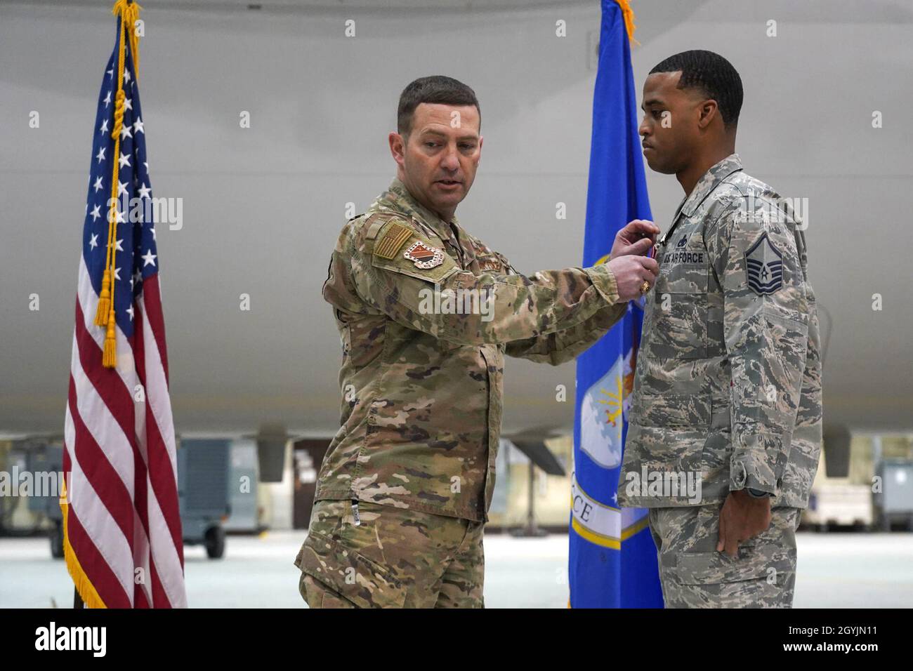 Air Force Col. Robert Davis, 3rd Wing commander, clips a Bronze Star ...