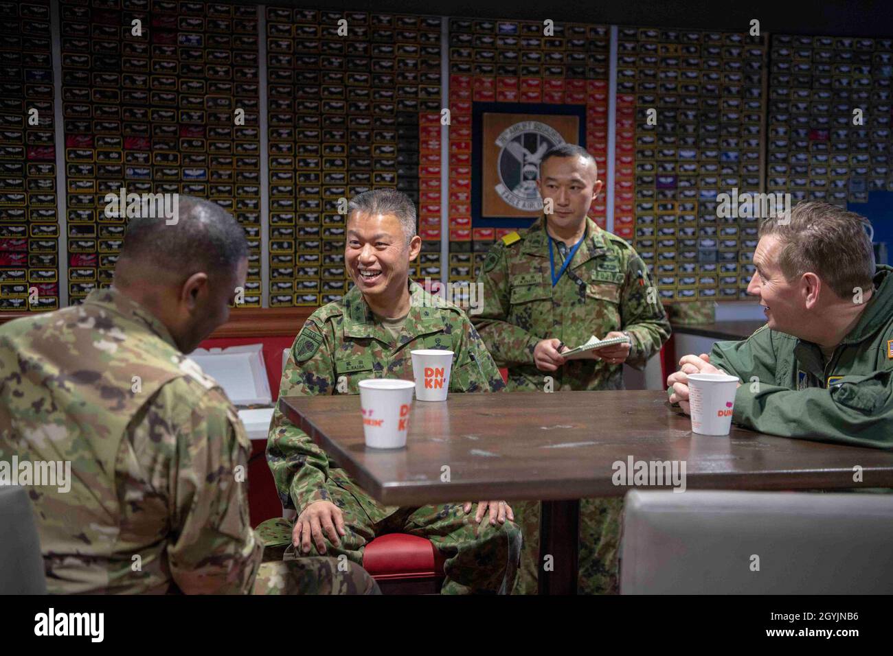 U.S. Air Force Col. Otis C. Jones, 374th Airlift Wing commander, left ...