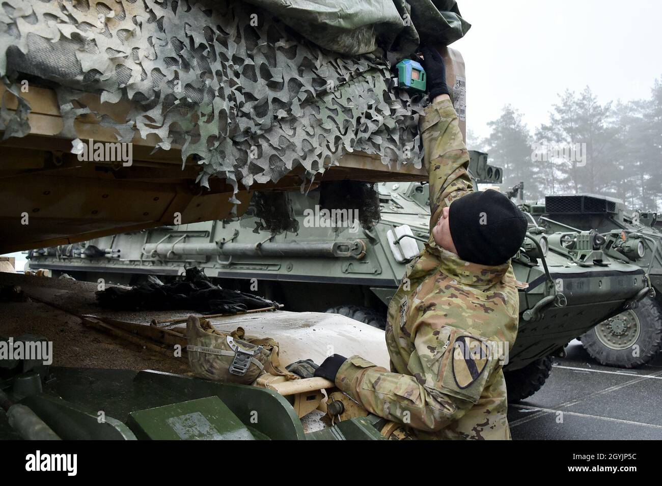 A U.S. Soldier with 1st Battalion, 8th Cavalry Regiment, 2nd Armored ...