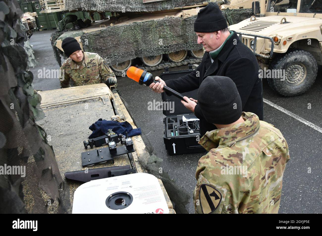 A contractor and a U.S. Soldier with 1st Battalion, 8th Cavalry ...