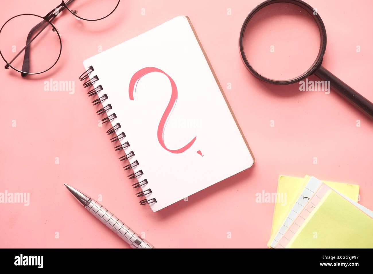 high angle view of question mark on paper on office desk Stock Photo ...