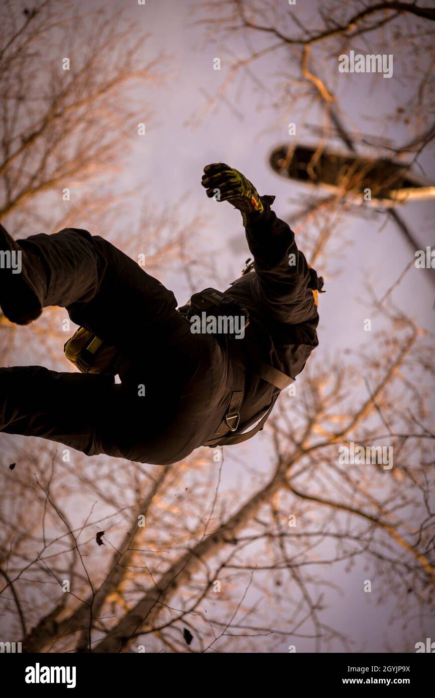 A North Carolina Helicopter Aquatic Rescue Team (NCHART) technician is ...