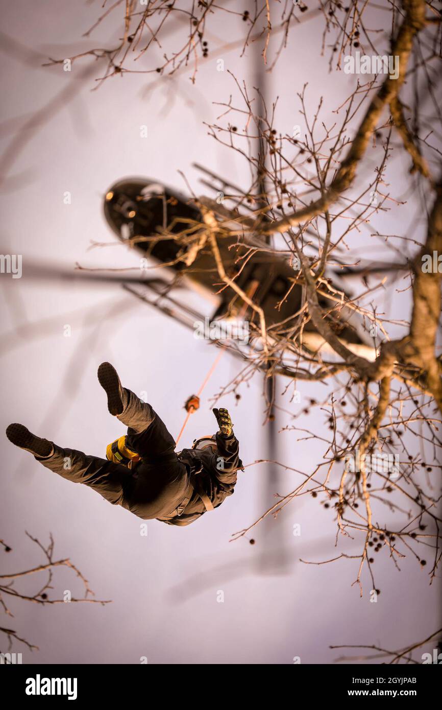 A North Carolina Helicopter Aquatic Rescue Team (NCHART) technician is ...