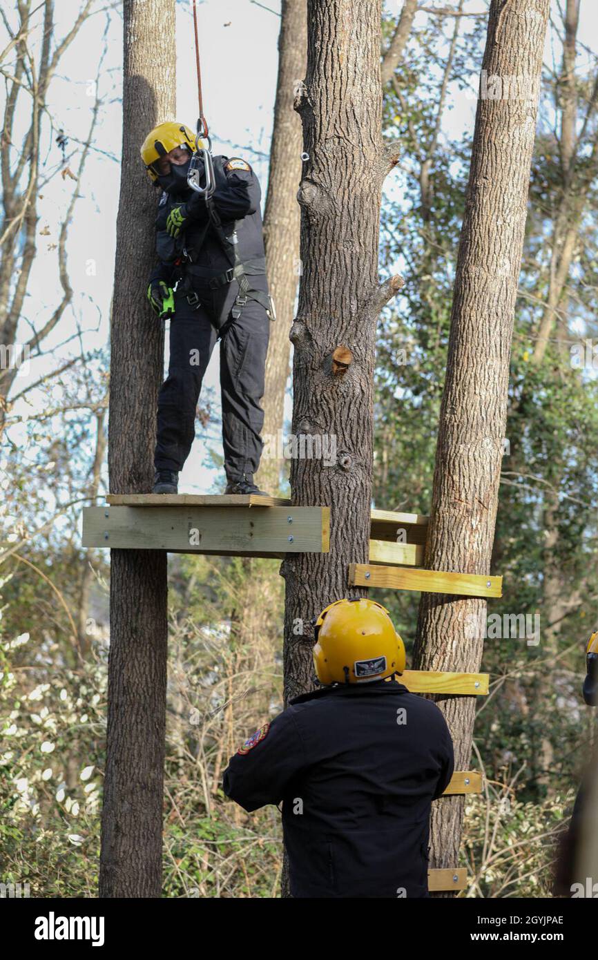 A North Carolina Helicopter Aquatic Rescue Team (NCHART) technician is ...